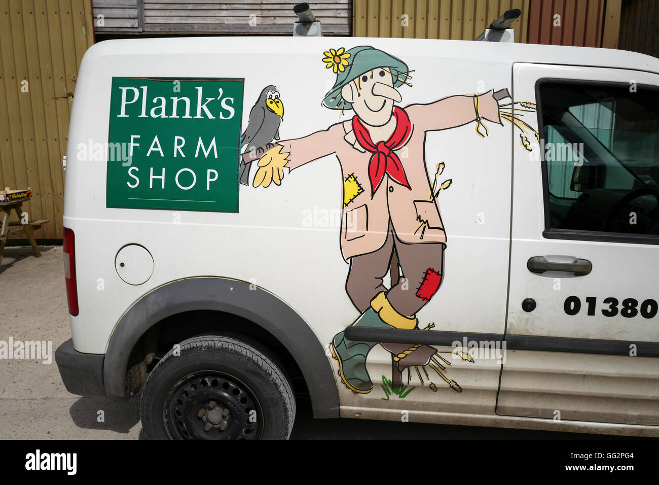 A local farm shop delivery van with farm shop name and scarecrow logo ...