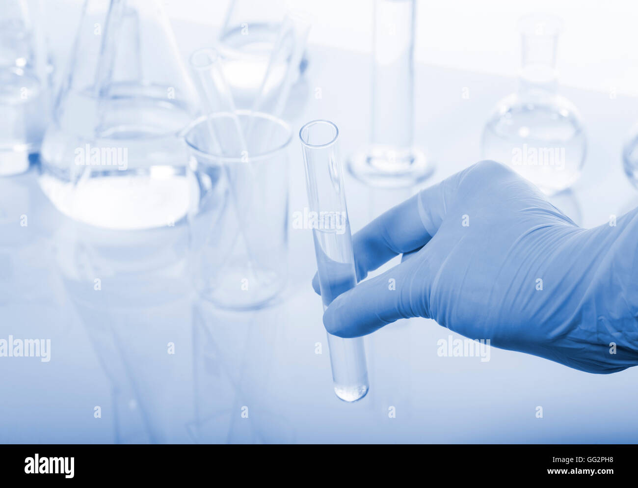 Test-tubes with reflections on a white and blue background. Laboratory ...