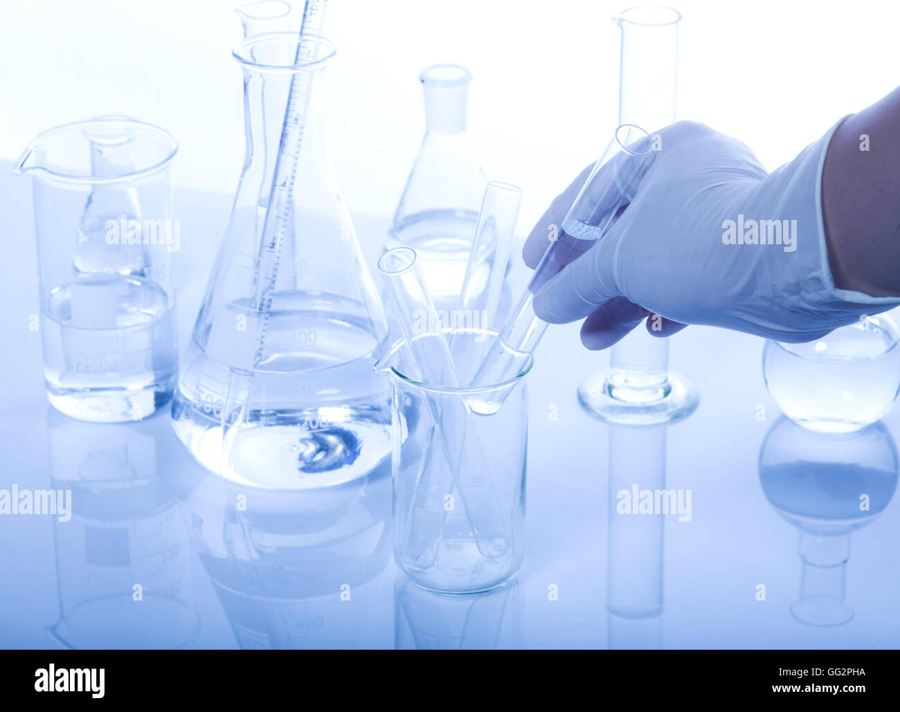 Test-tubes with reflections on a white and blue background. Laboratory ...