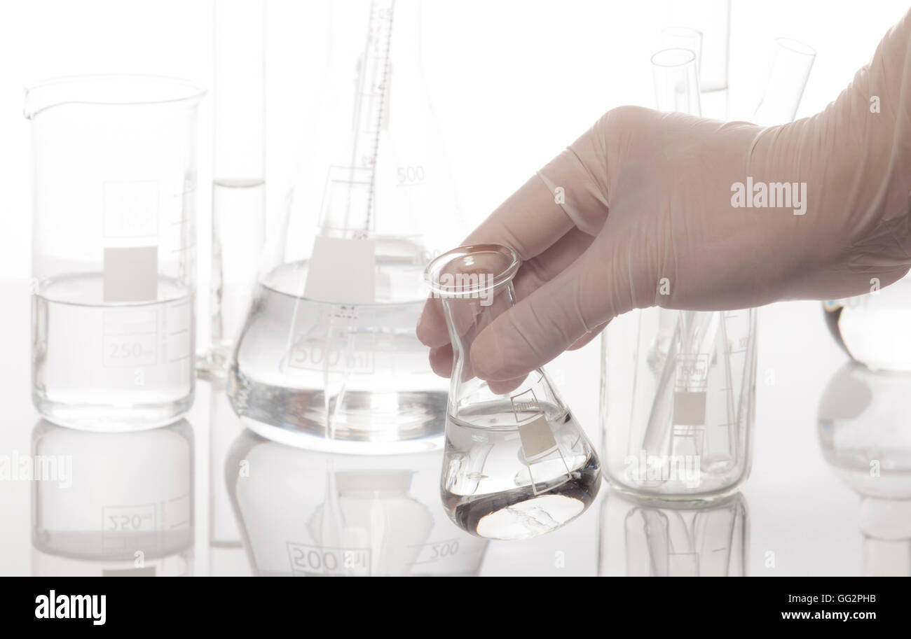 Test-tubes with reflections on a white background. Laboratory glassware ...
