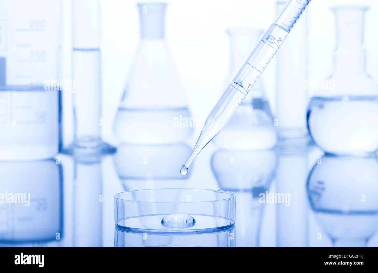Test-tubes with reflections on a white and blue background. Laboratory ...