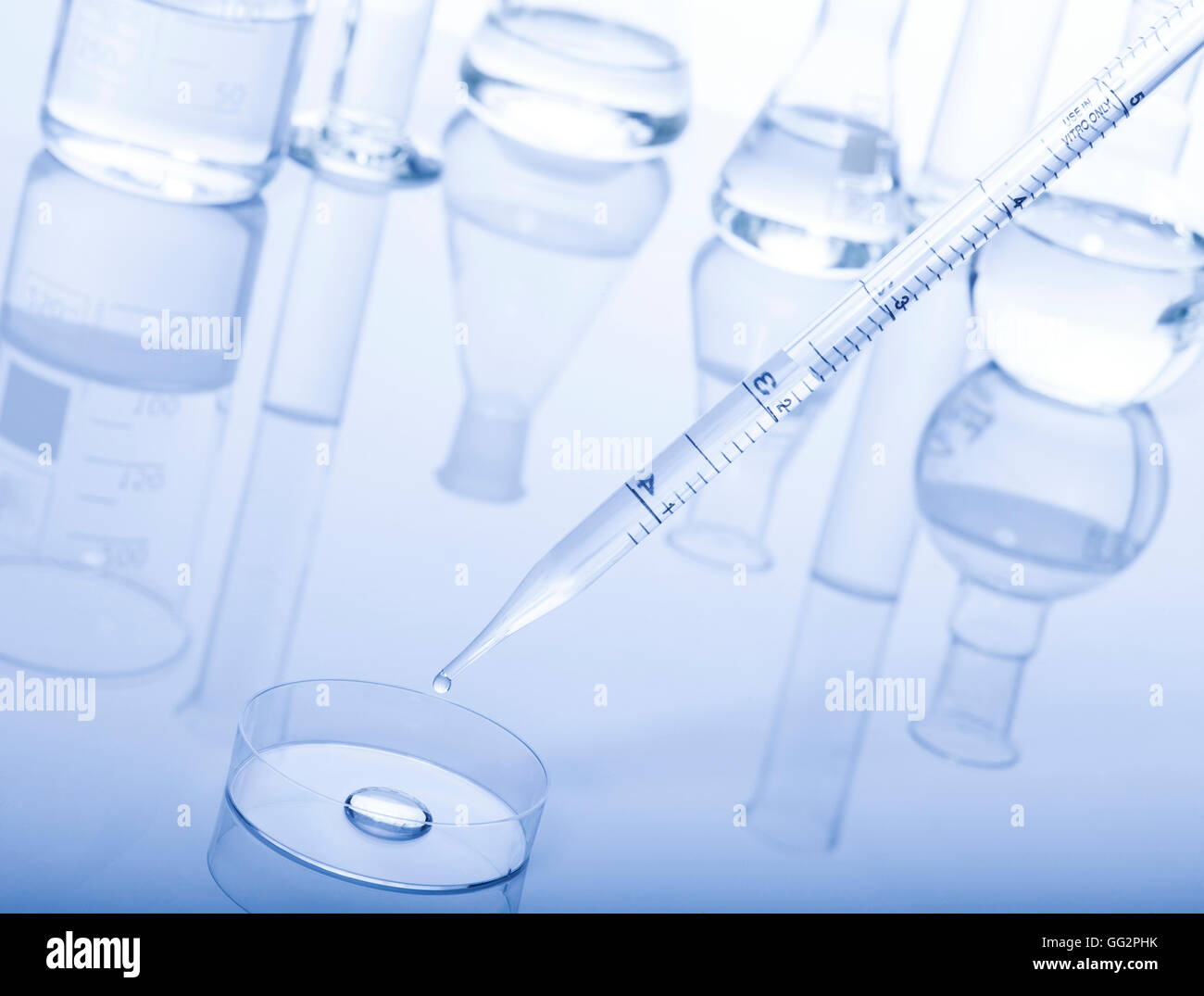 Test-tubes with reflections on a white and blue background. Laboratory ...