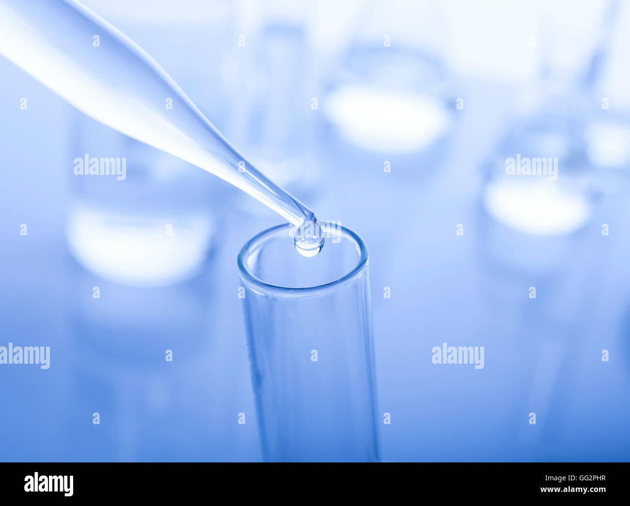 Test-tubes with reflections on a white and blue background. Laboratory ...