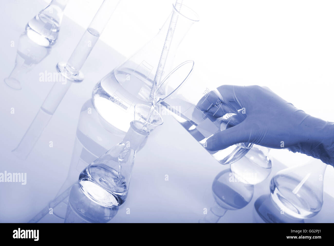 Test-tubes with reflections on a white and blue background. Laboratory ...