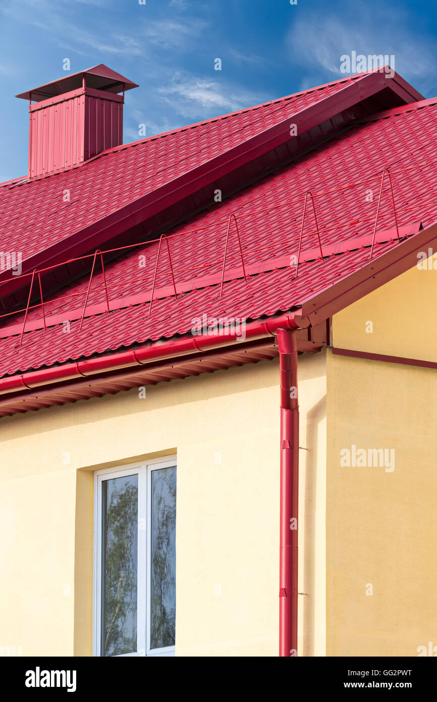 new red tiled roof with chimney and rain gutter Stock Photo - Alamy