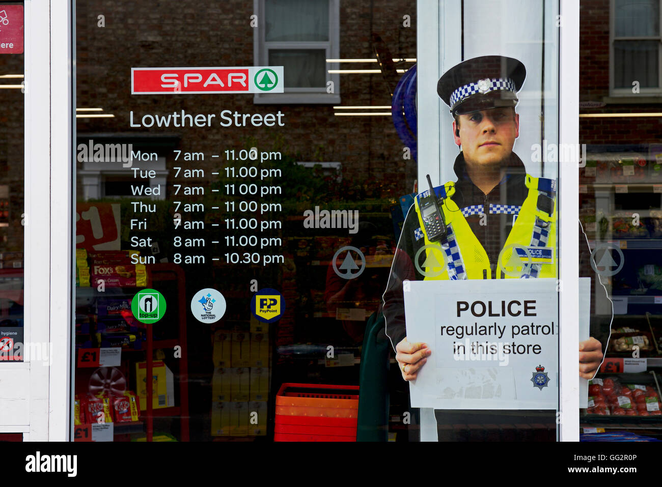 Sign in window of Spar store, with cut-out picture of policeman Stock ...