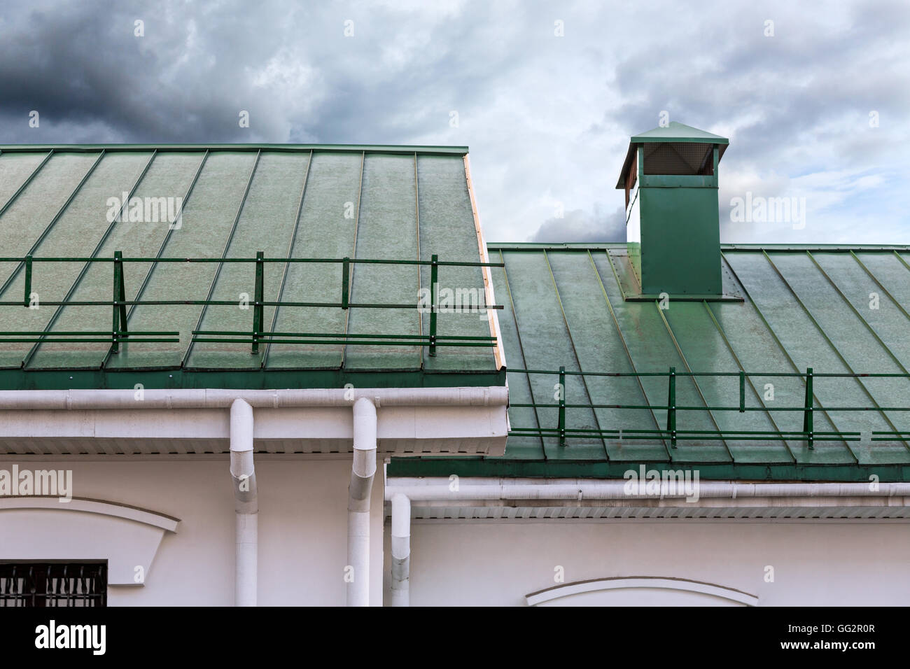 Green metallic roof of house with gutter and chimney Stock Photo - Alamy
