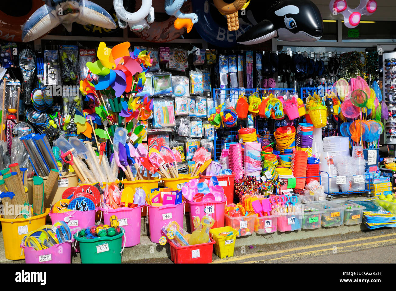 Colourful beach merchandise on sale outside a gift shop Stock Photo - Alamy