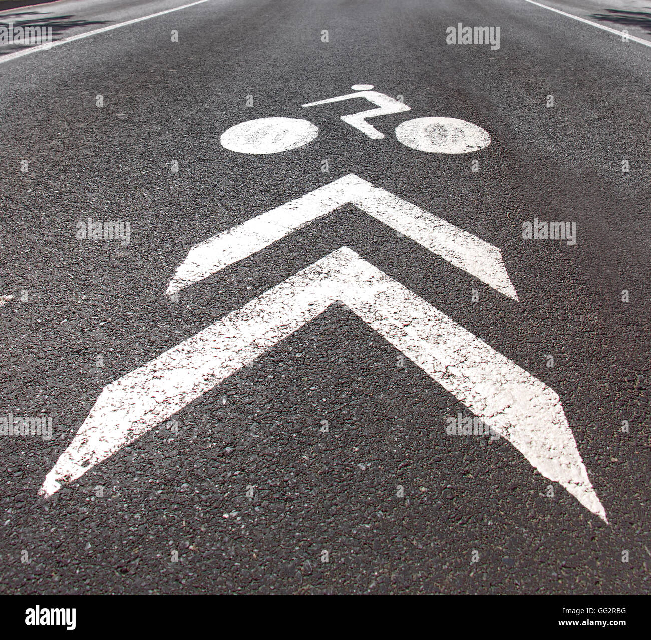 white painted signpost for cyclists on the road Stock Photo - Alamy