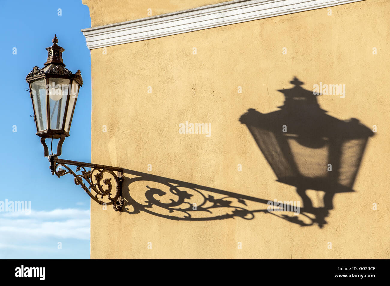 decorative street lamp with shadow on the facade of the house Stock ...