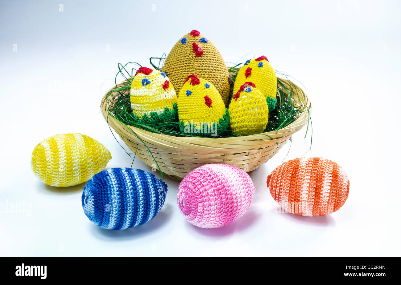 A brood of crochet chickens and some easter eggs Stock Photo - Alamy