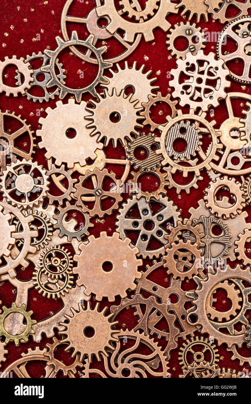 Vintage Mechanical Cogwheel Gears Wheels, close up on red background ...