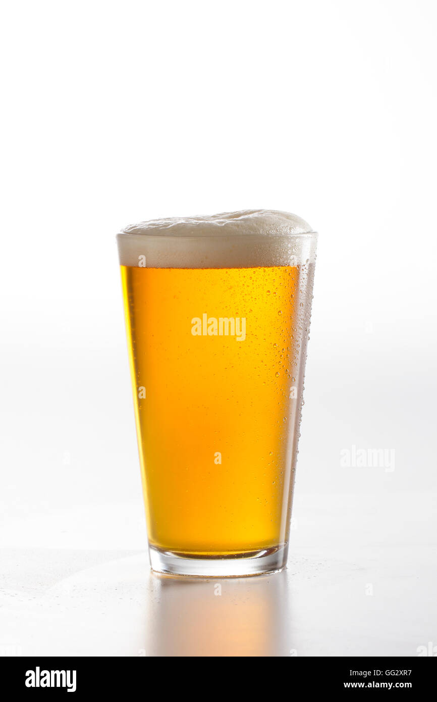 A pint of cold beer on a white background Stock Photo - Alamy