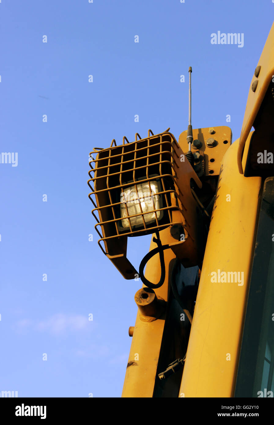lantern, secure grille, on the roof of a bulldozer at a construction ...