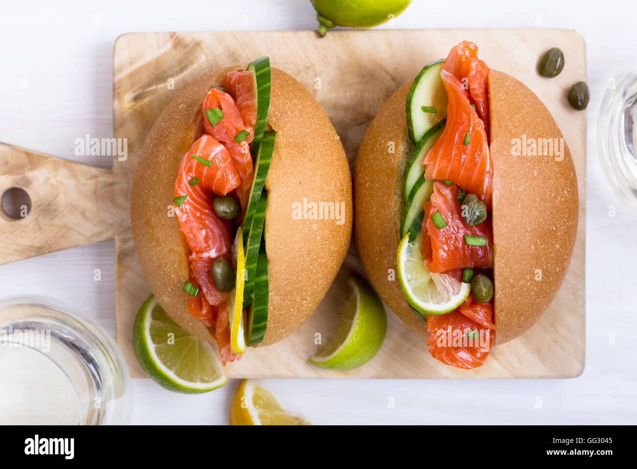 Smoked salmon bun sandwich with cucumber and capers, top view Stock ...