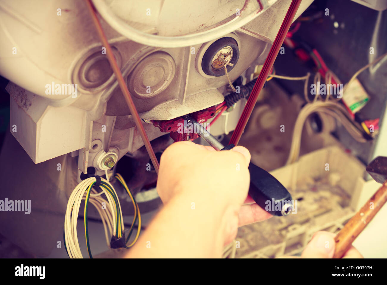 Domestic mechanical industrial concept. Mechanic repairing washing ...
