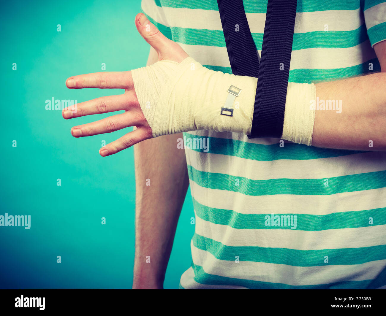 Fractures and dislocations concept. Part body male with hand in bandage ...