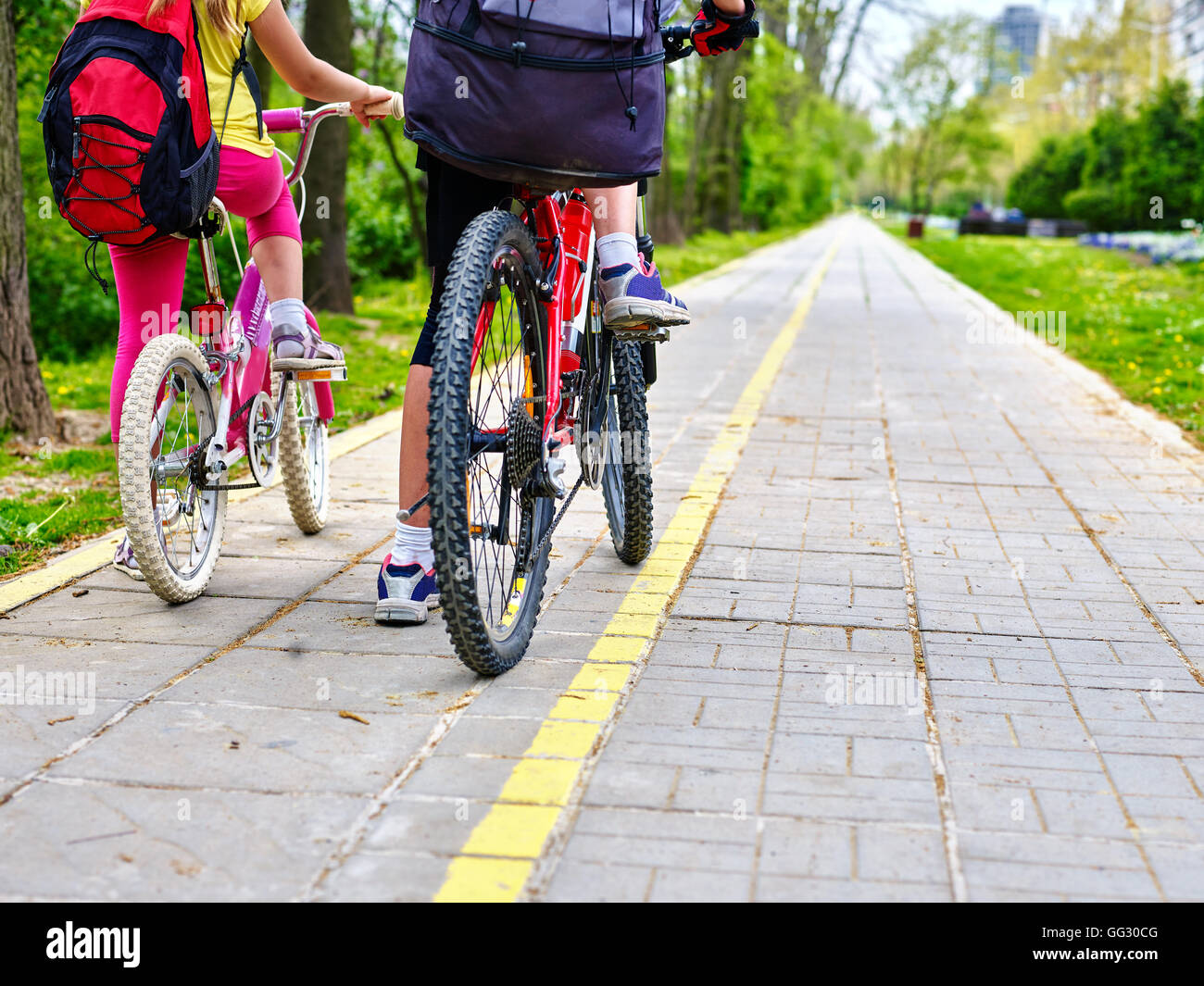 Leg of girls ride on bicycle Stock Photo - Alamy