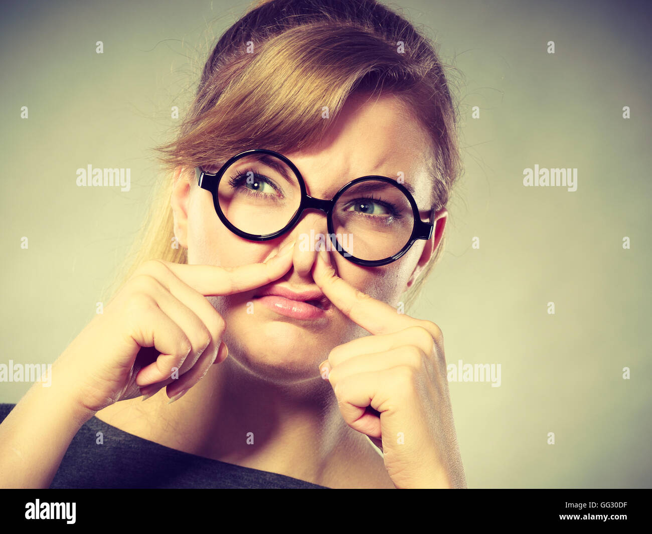 Woman pinches nose fingers hi-res stock photography and images - Alamy