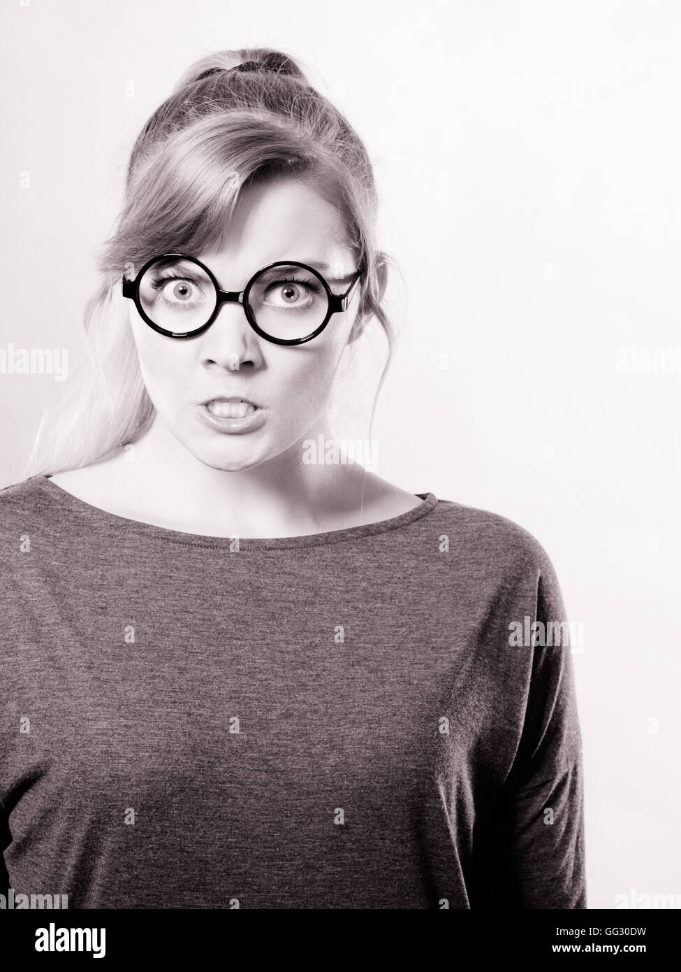 Anger and rage concept. Young expressive woman show her bad face. Angry ...