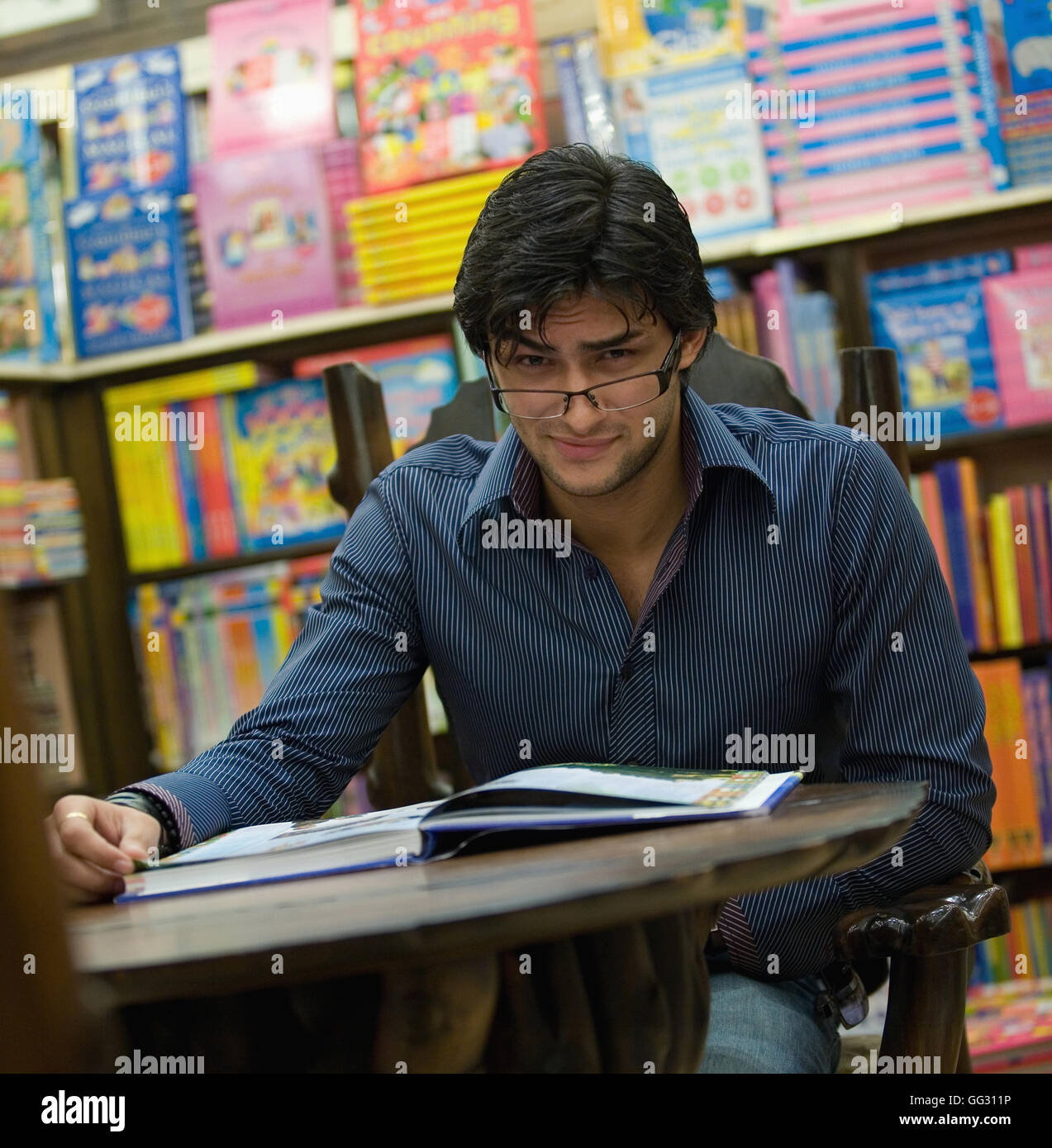 Man reading a book Stock Photo - Alamy