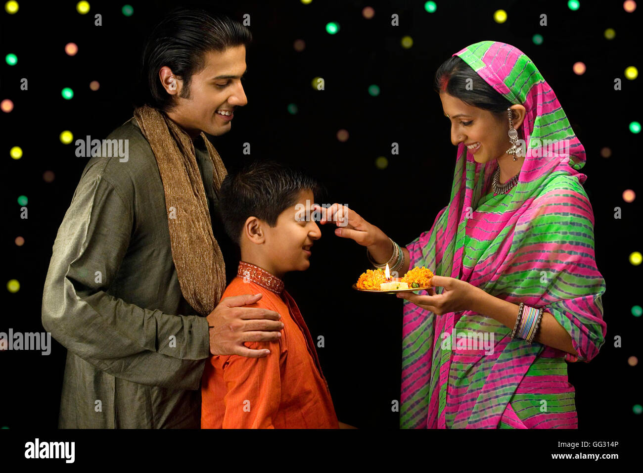 Family celebrating festival Stock Photo - Alamy
