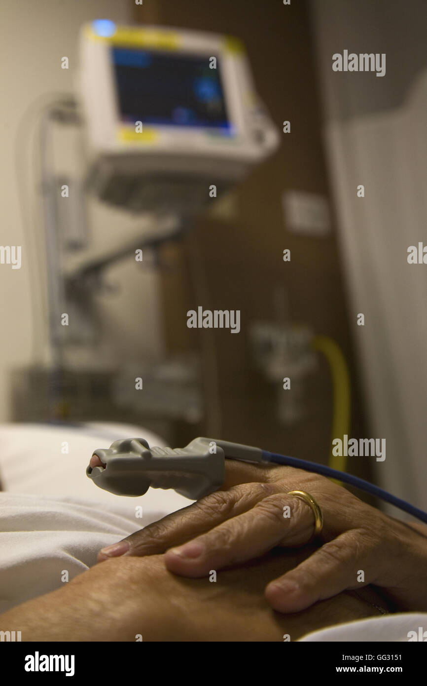 Blood pressure finger monitor Stock Photo - Alamy