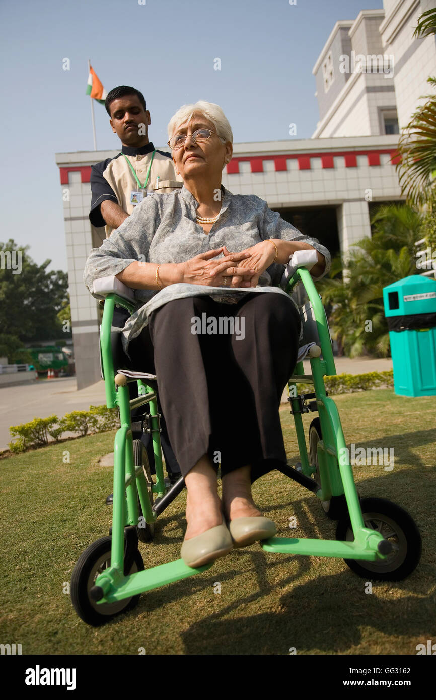 Patient accompanied by attendant Stock Photo - Alamy