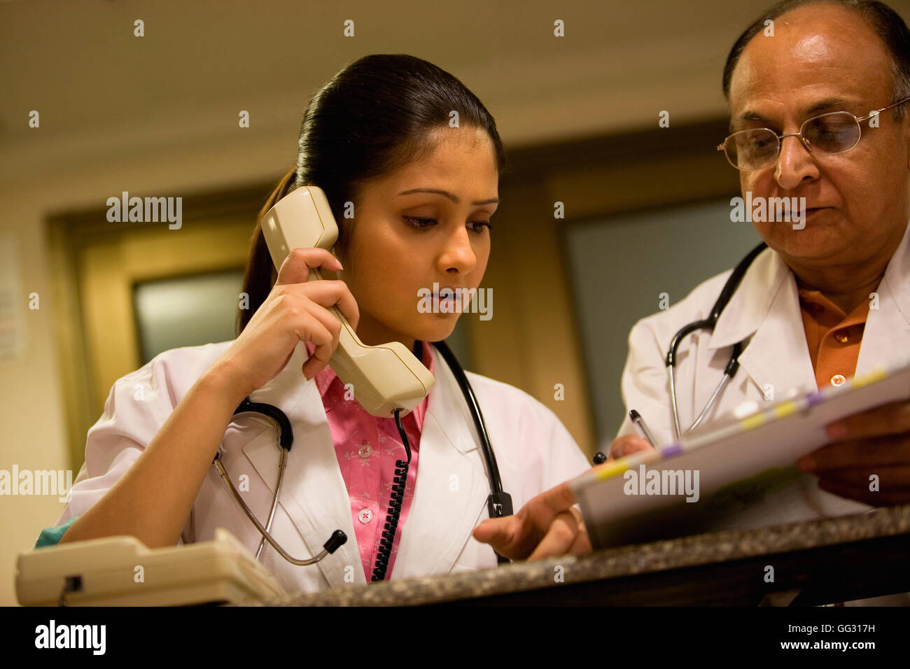 Two doctors discussing work Stock Photo - Alamy