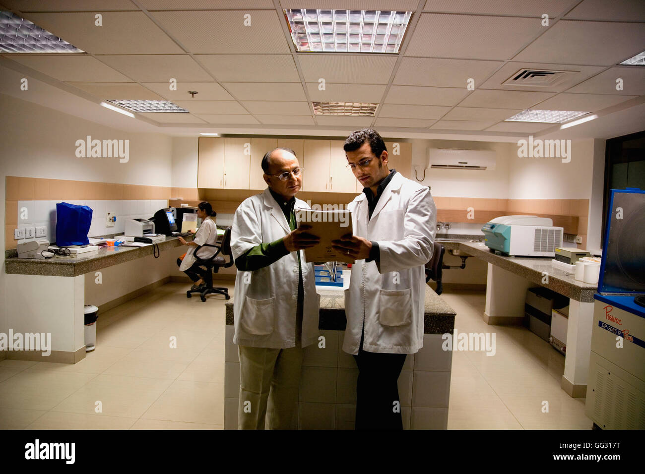 Two doctors consulting Stock Photo - Alamy