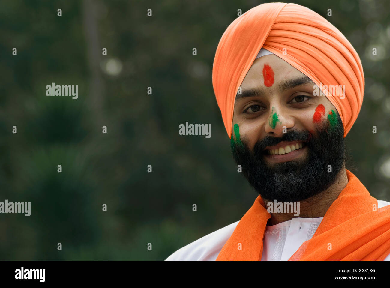 A Sikh man smiling Stock Photo - Alamy