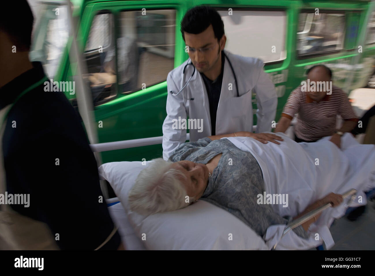 Doctor rushing elderly patient hospital hi-res stock photography and ...