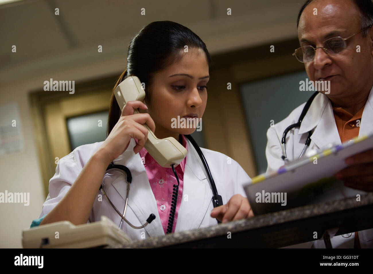 Two doctors discussing work Stock Photo - Alamy