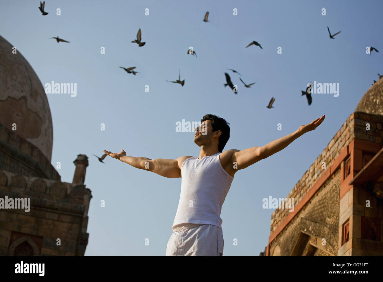 Man stretching out his arms Stock Photo - Alamy