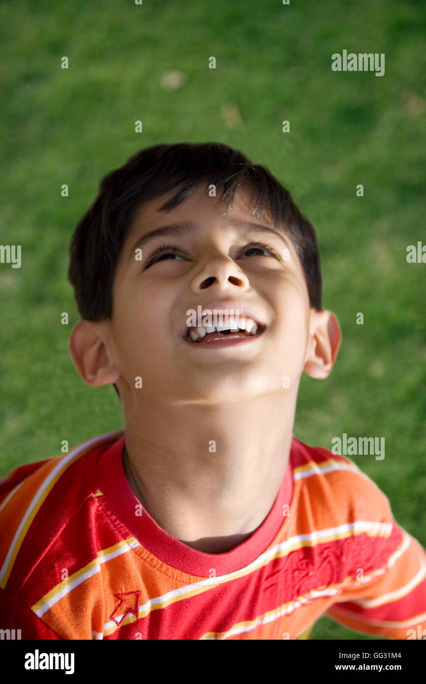 Boy looking up Stock Photo - Alamy