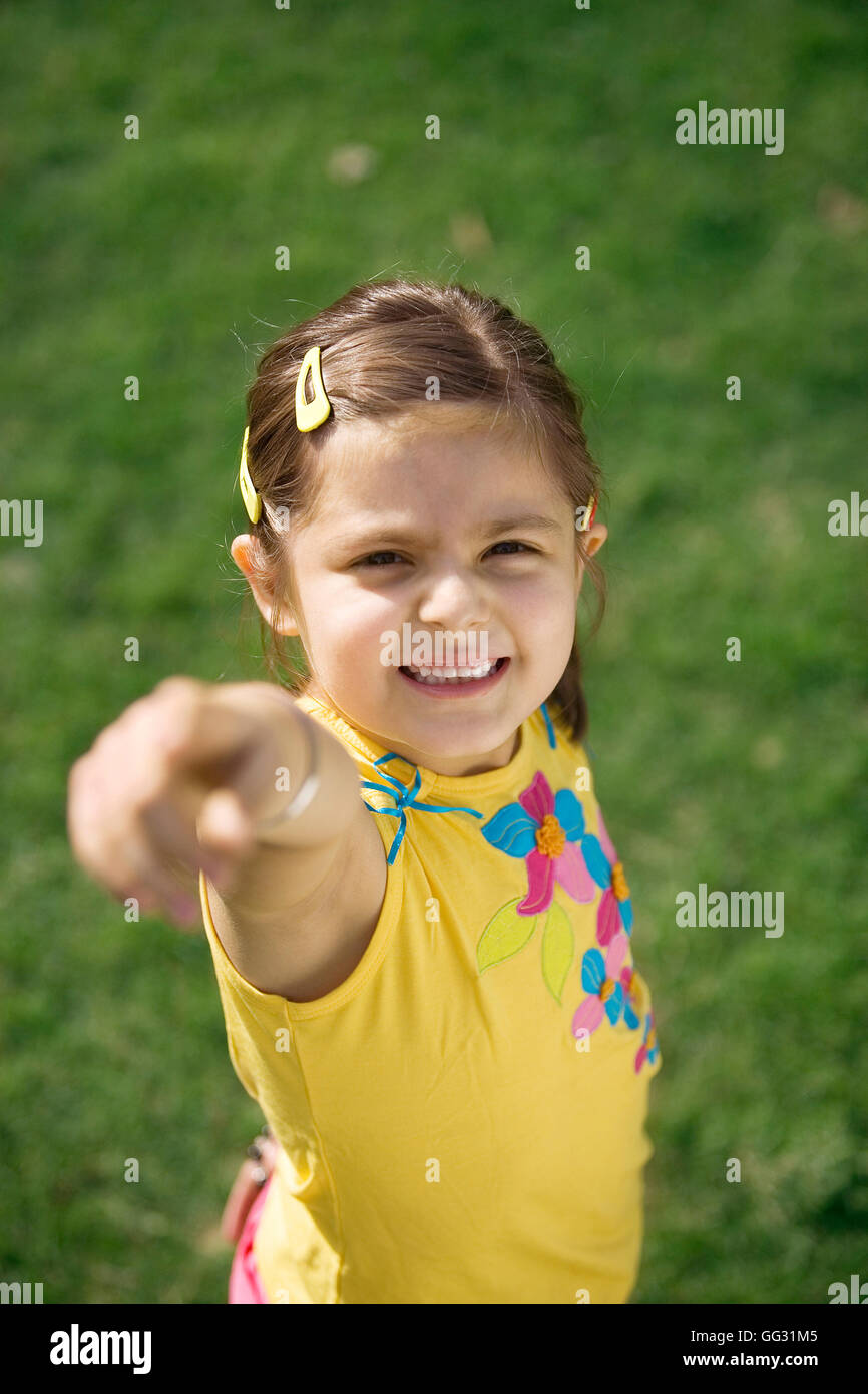 Girl pointing a finger Stock Photo - Alamy