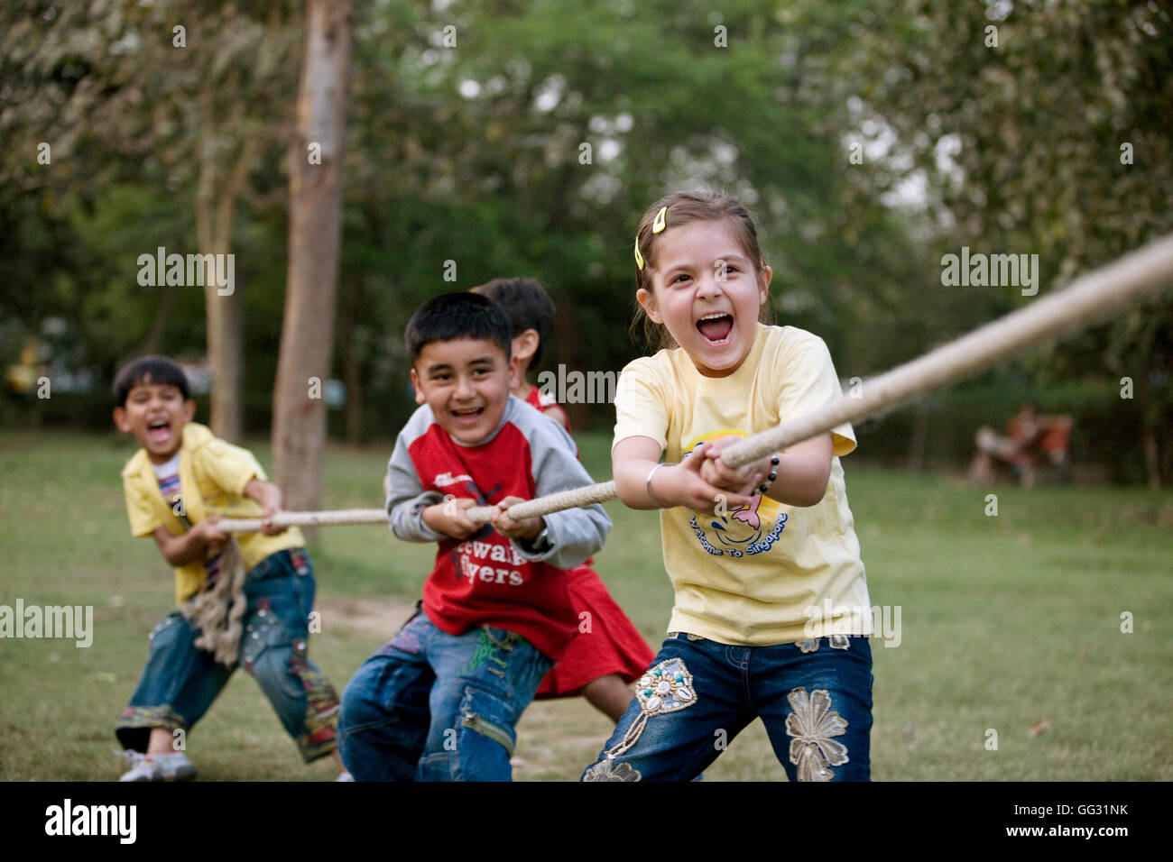Children pulling a rope Stock Photo - Alamy