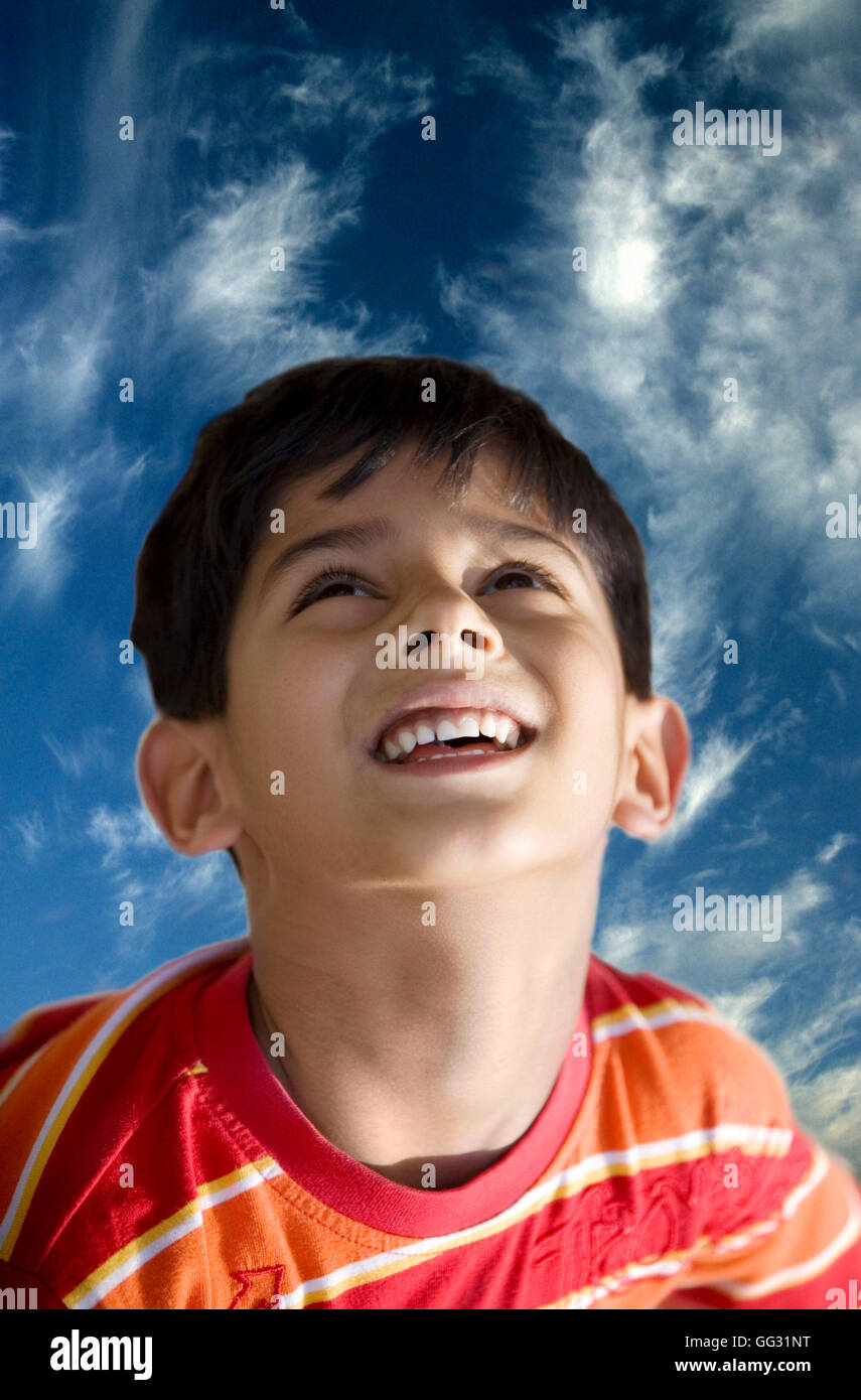Boy looking up Stock Photo - Alamy