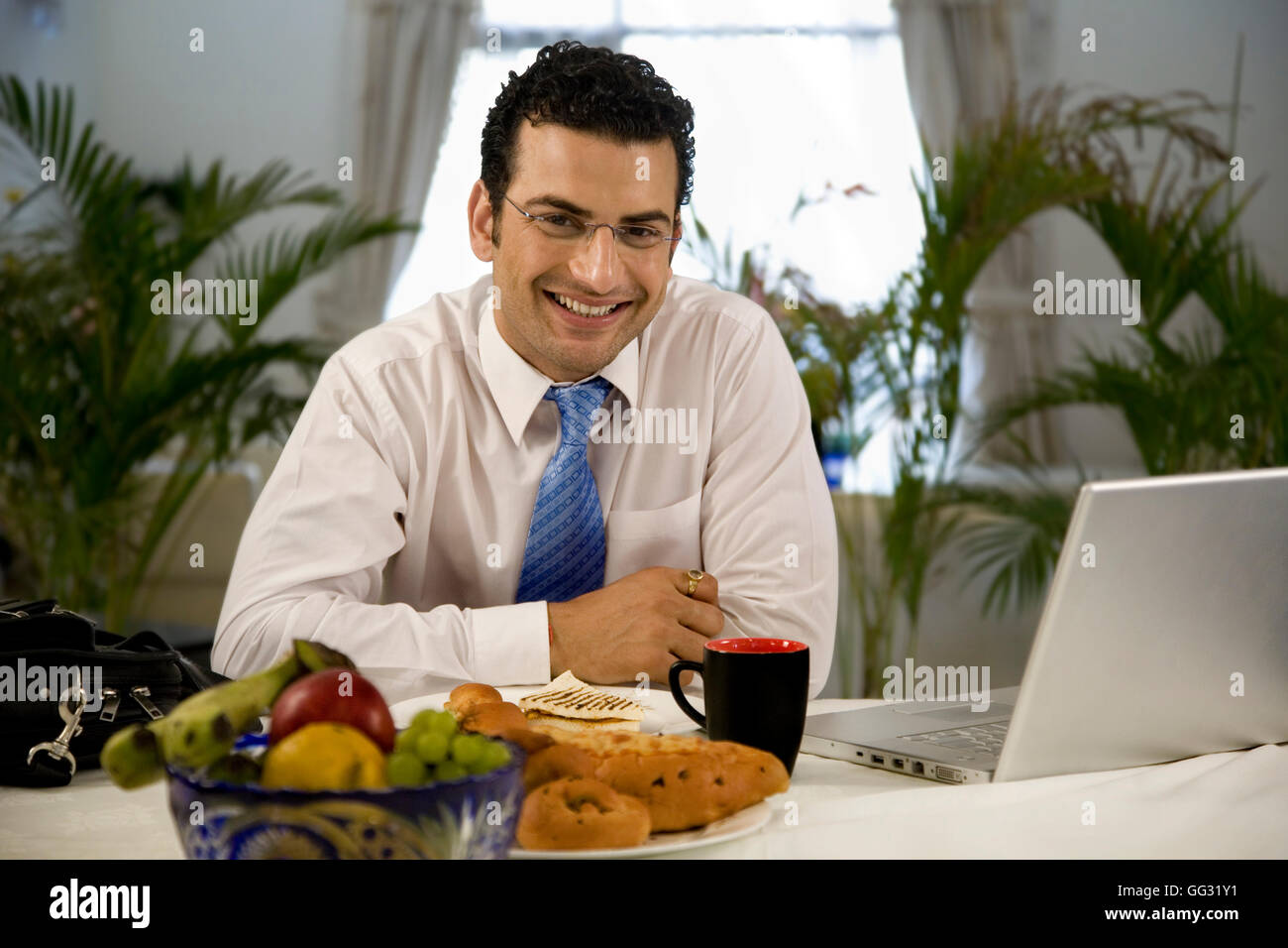 Man at the dining table Stock Photo - Alamy