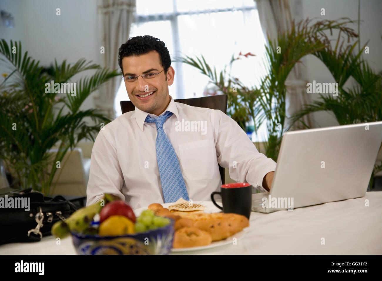 Man at the dining table Stock Photo - Alamy