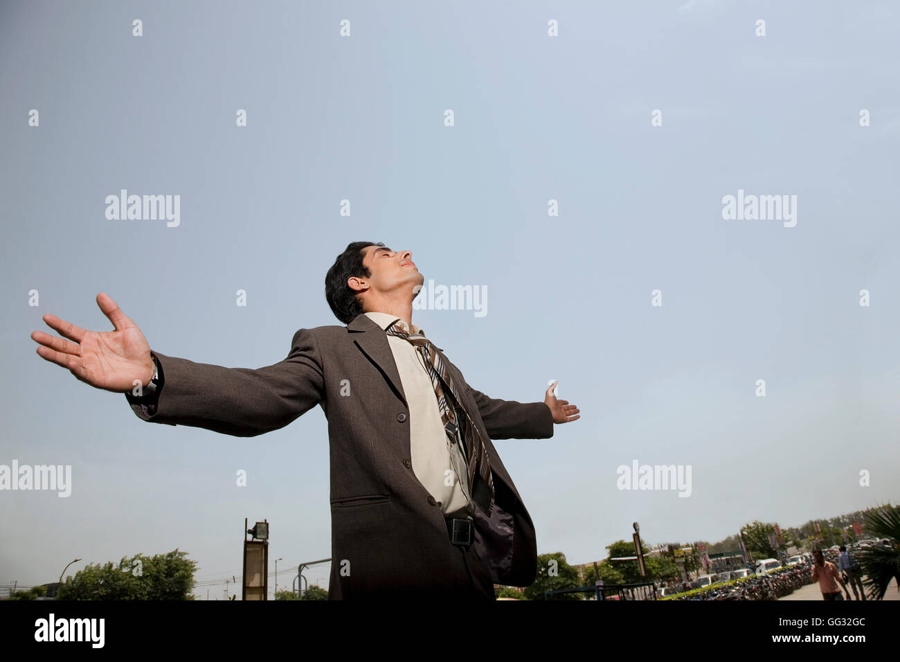 Executive with open arms Stock Photo - Alamy