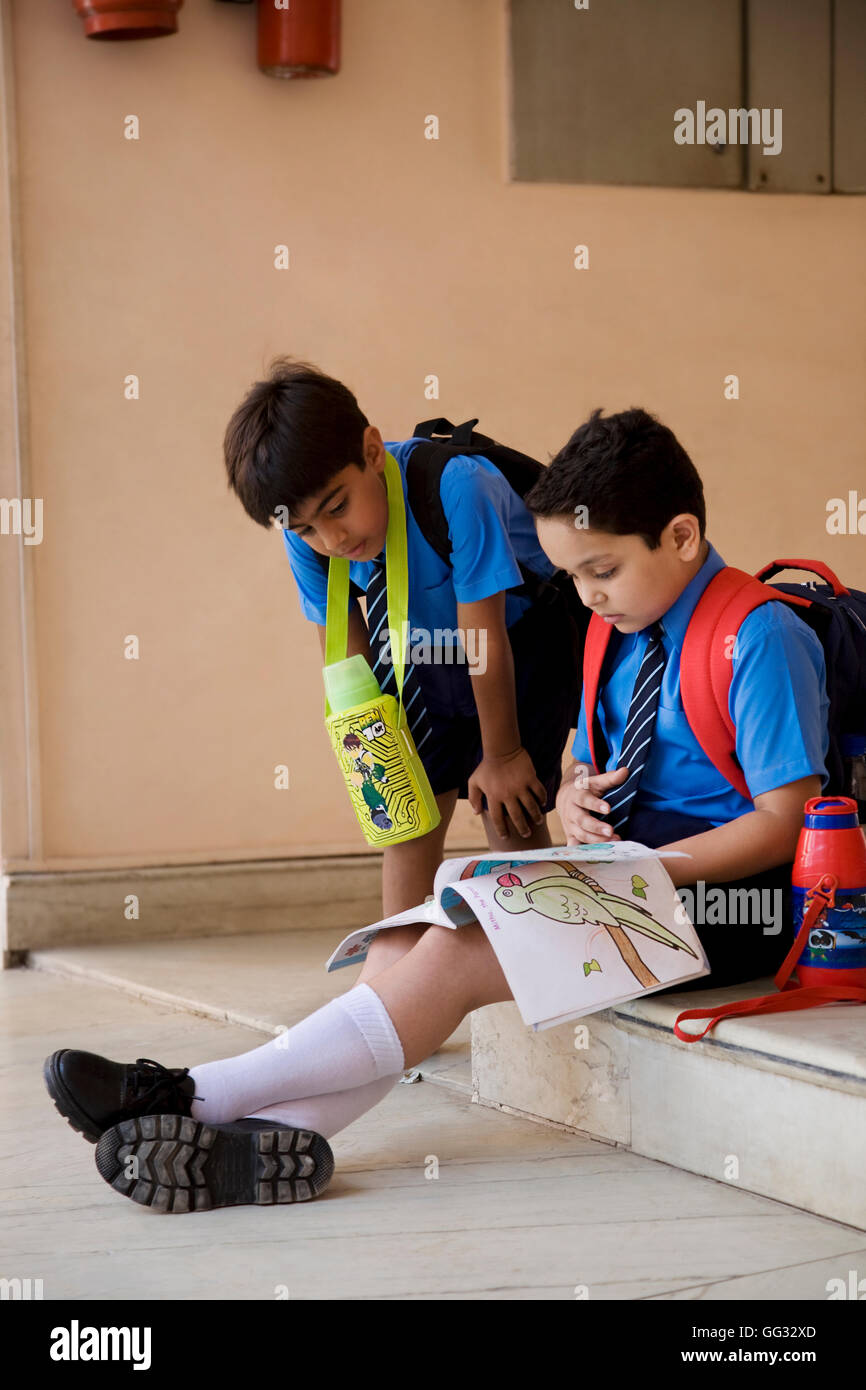 School boy sitting on the steps Stock Photo - Alamy