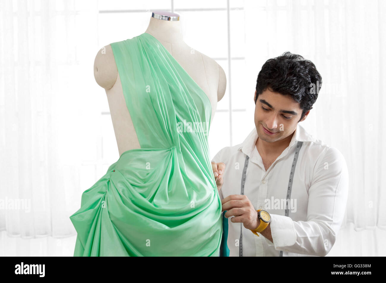 Male tailor working on dressmaker's form Stock Photo - Alamy