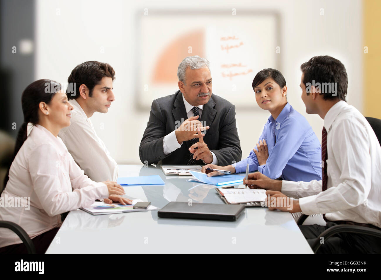 Business team discussing together in a meeting Stock Photo - Alamy