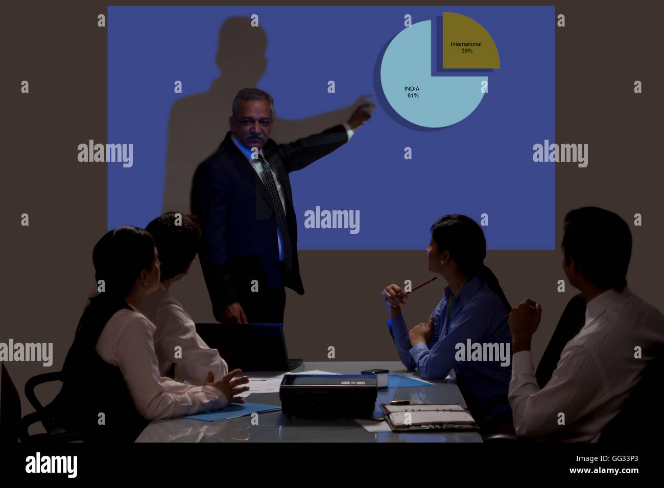 Businessman giving presentation on projection screen in seminar Stock ...