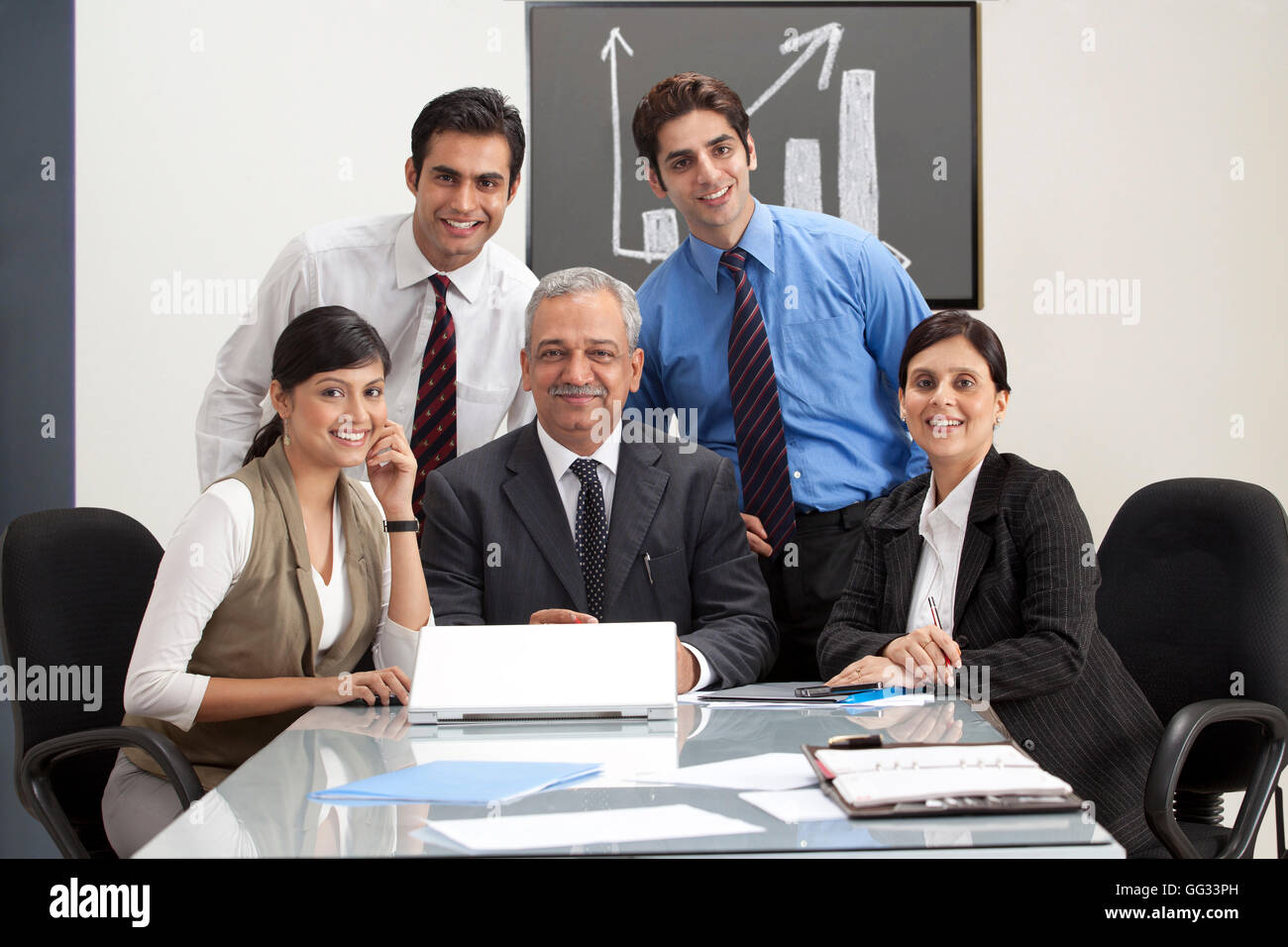 Successful business people smiling with confidence Stock Photo - Alamy