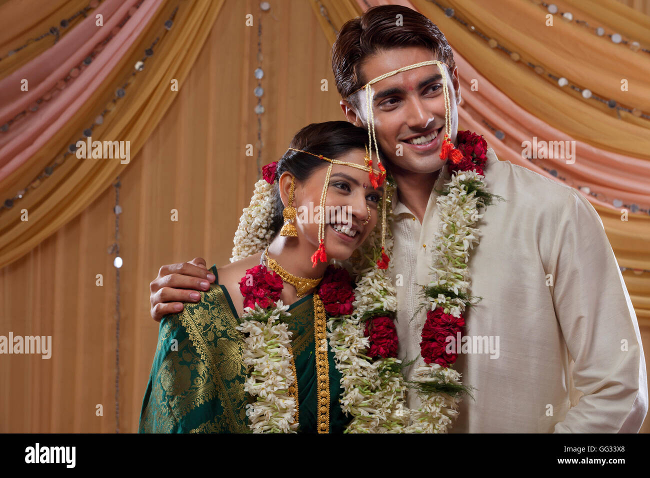 Affectionate young married couple smiling together Stock Photo - Alamy