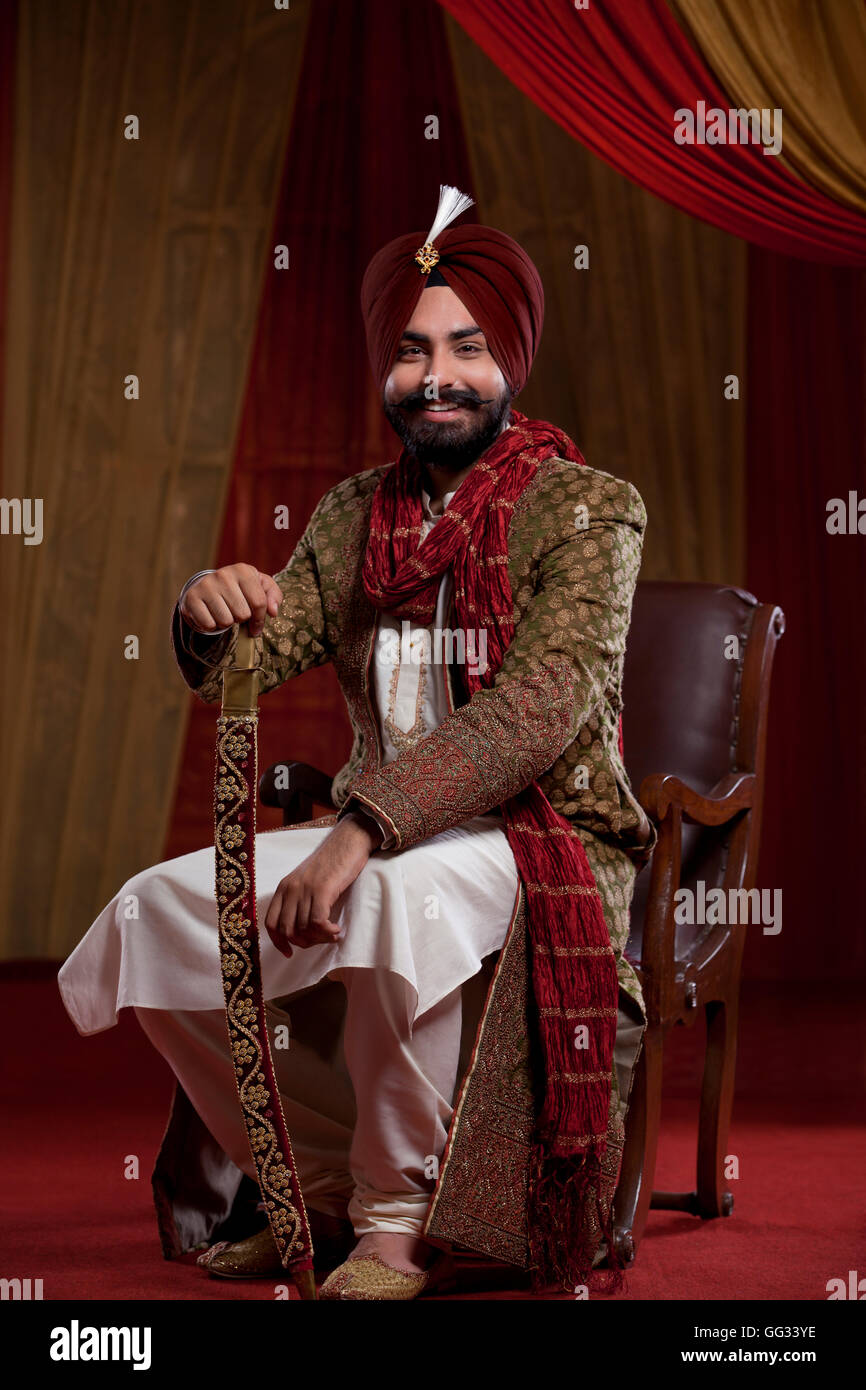 Portrait of smiling man in traditional clothes Stock Photo - Alamy