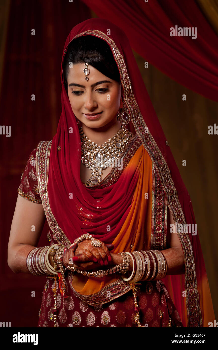 An Indian bride looking down Stock Photo - Alamy