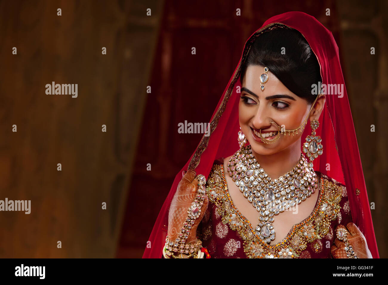 Smiling bride in traditional clothing and jewelry Stock Photo - Alamy